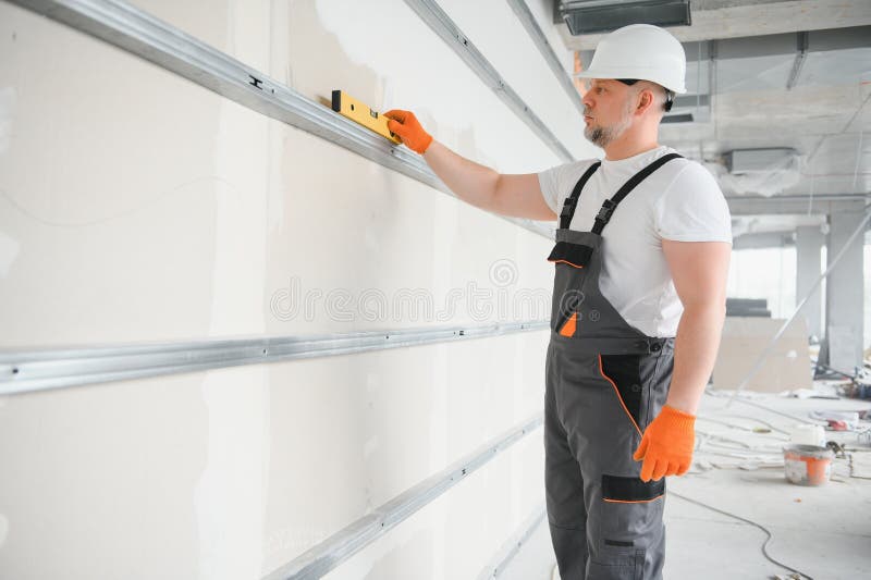 Man Drywall Worker Installing Plasterboard Sheet To Wall Stock Image ...