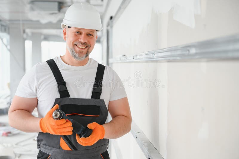 Man Drywall Worker Installing Plasterboard Sheet To Wall Stock Image ...