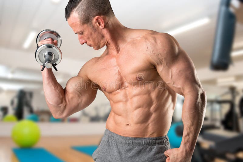 Man with dumbbell stock photo. Image of athlete, ripped - 99875832