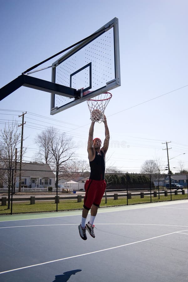 Man Dunking a Basketball stock image. Image of player - 9356367