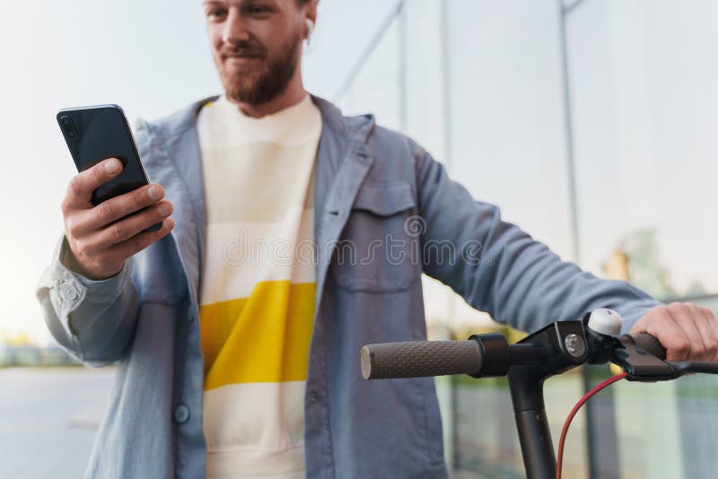 Man with E-scooter Using Scooter-sharing System Application on His ...