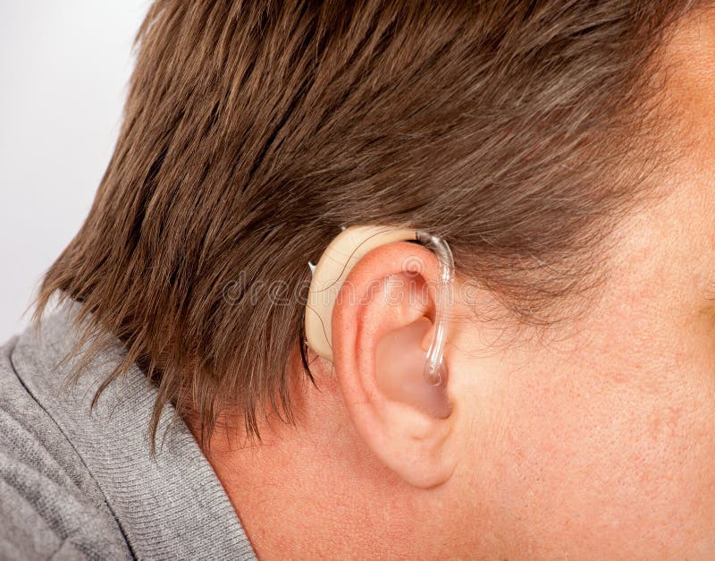 Man ear with hearing aid stock image. Image of support - 73477073