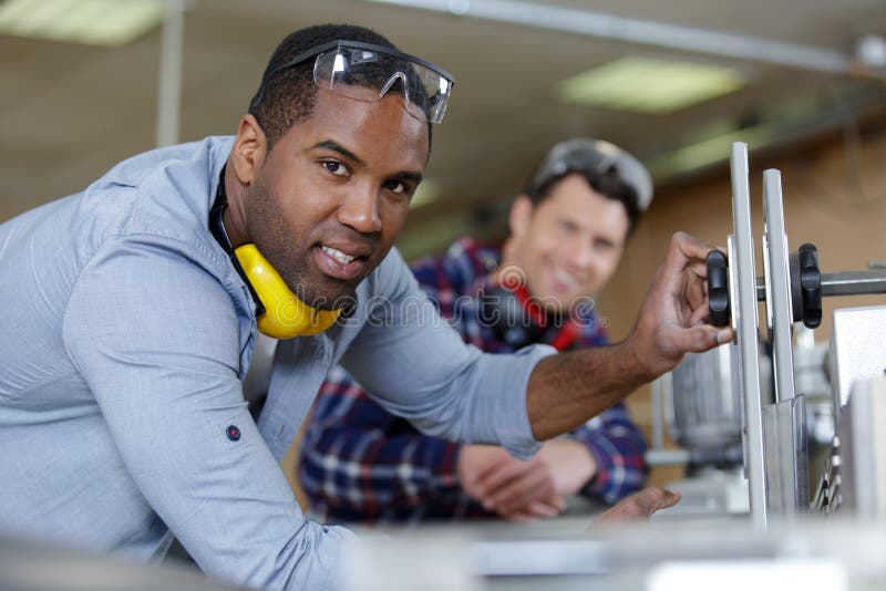 Man with Ear Protection Working in Factory Stock Photo - Image of ...
