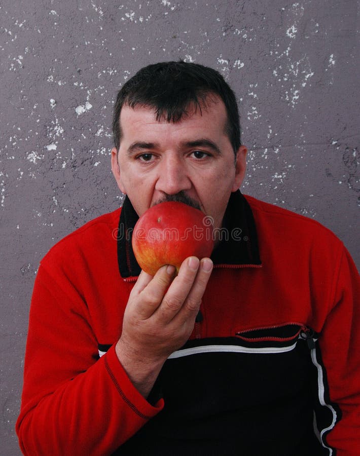 Man eat apple stock photo. Image of look, casual, handsome - 47316718