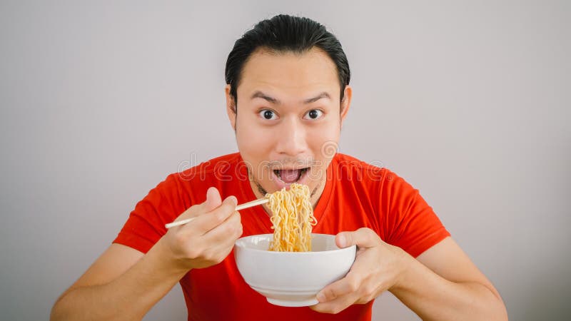 Man eat noodles. stock photo. Image of food, indian, mama - 65496156