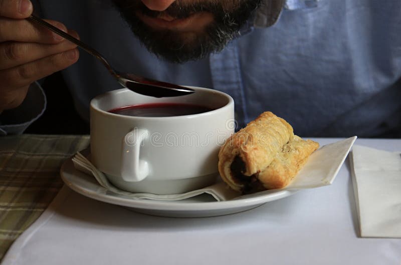 Man Eating Beetroot Soup stock image. Image of person - 104761445