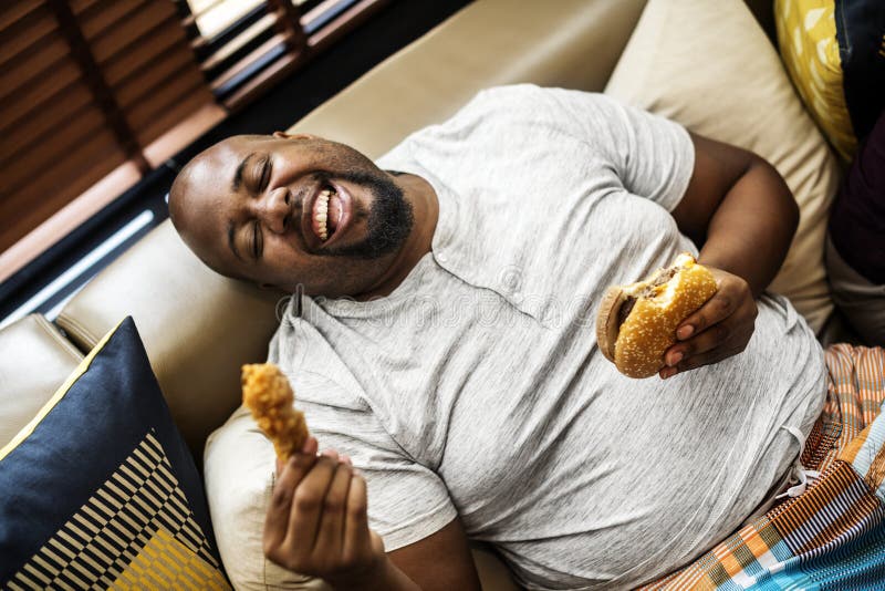 Man eating a big hamburger stock image. Image of issue - 117272323