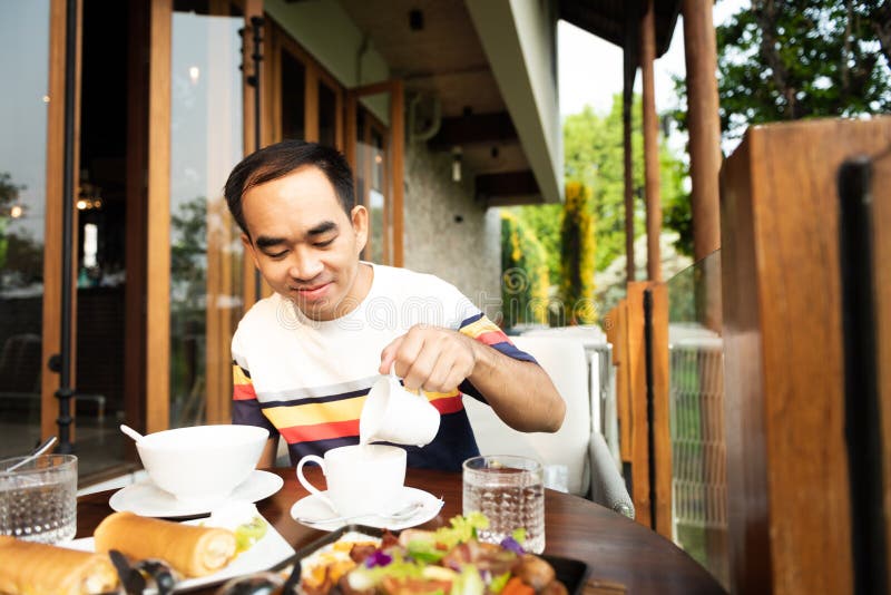 Man Eating Breakfast in a Hotel Stock Photo - Image of happily, eating ...