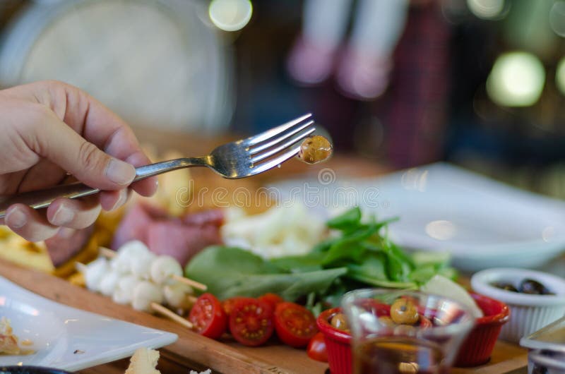 The Man is Eating Breakfast in the Restaurant. Stock Image - Image of ...