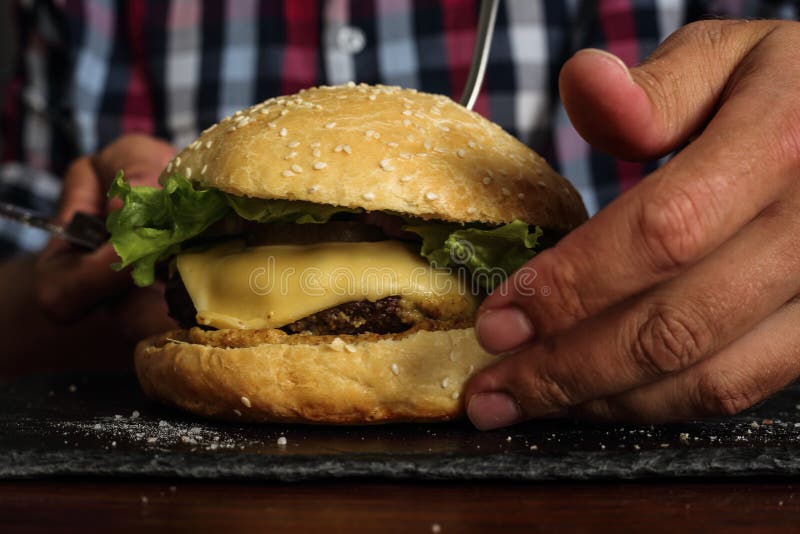 Man eating burger stock photo. Image of cook, caucasian - 118743592