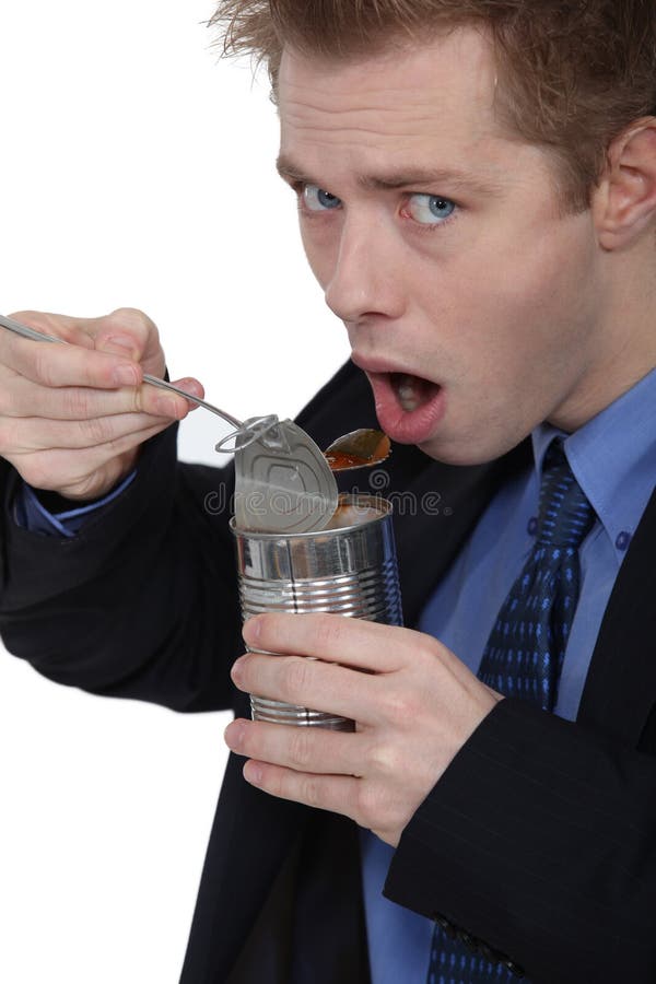 Man eating canned food stock photo. Image of work, propaganda - 29067726