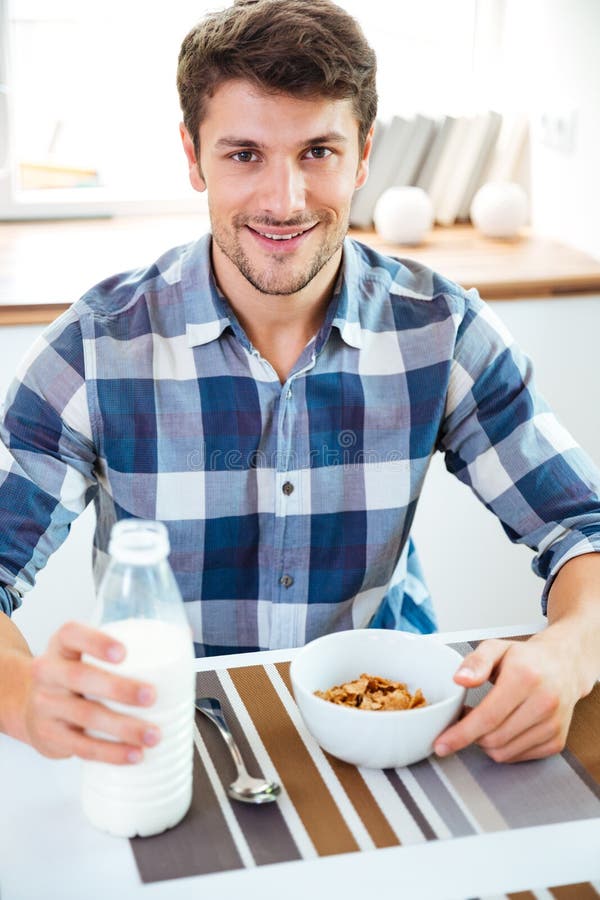 Cheerful Young Man Eating Cereal Spoon Stock Photos - Free & Royalty ...
