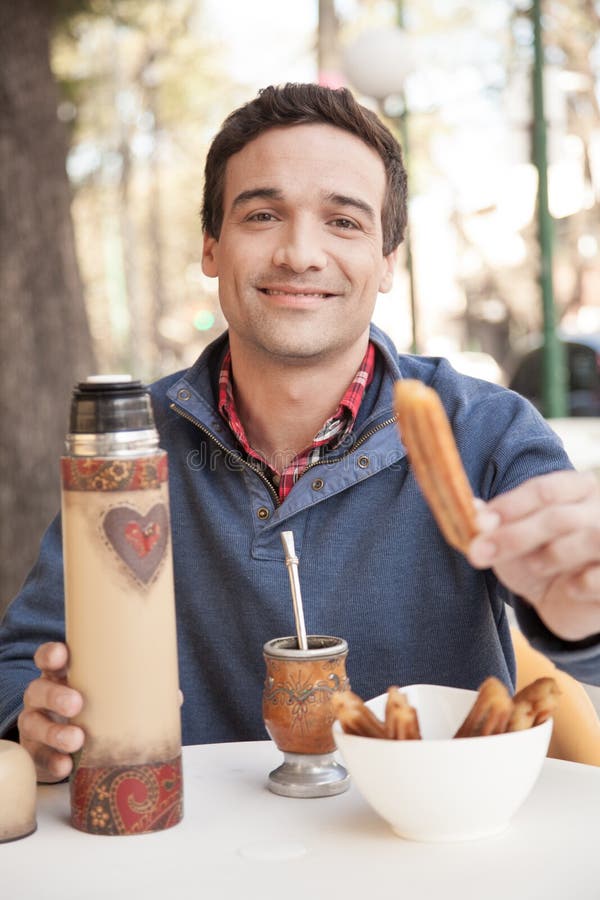 Man eating churro stock image. Image of modern, life - 66714449