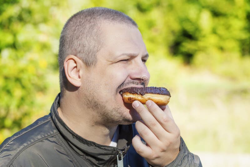 Man eating donuts stock photo. Image of figure, fatness - 33700244