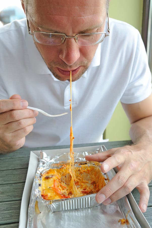 Man eating fast food stock image. Image of hungry, glass - 31789261