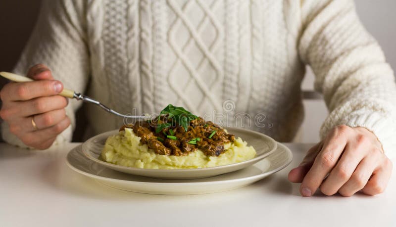 Man Eating with Fork the Beef Stroganoff and Mashed Potatoes Stock ...