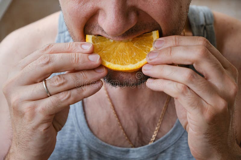 Man Eating a Fresh Orange at Home Stock Image - Image of diet ...