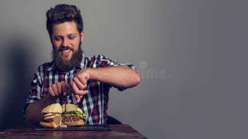 Man eating burger stock photo. Image of cook, fork, concept - 118743610