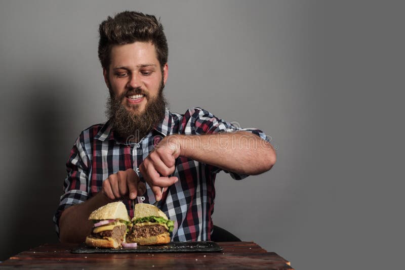 Man eating burger stock image. Image of beef, bearded - 120793075