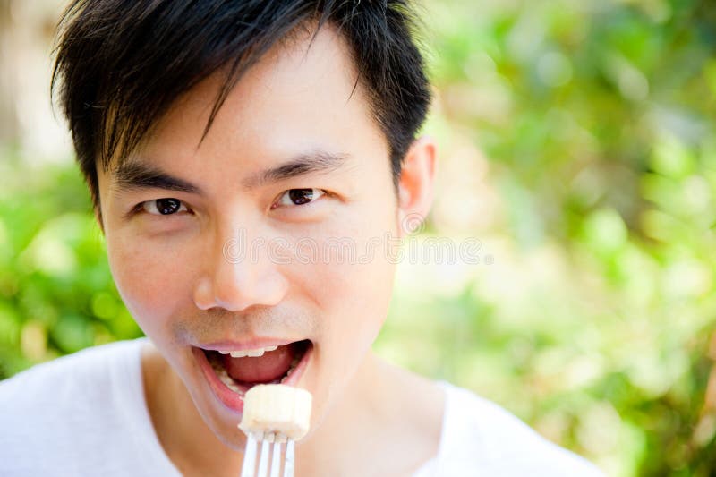 Man Eating Fruit stock photo. Image of young, outside - 11898986