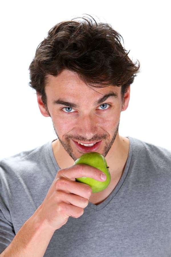 Man eating an green apple stock image. Image of season - 34037465