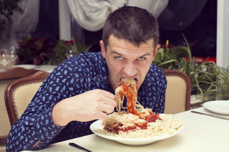 Man Eating a Large Portion of Pasta Stock Image - Image of couple ...