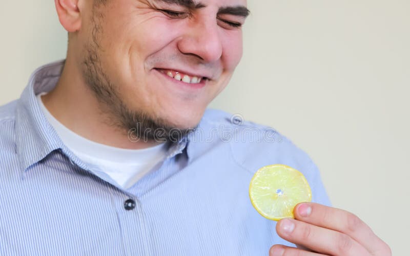 Man Eating Lemon. Laugh from Sour Taste Stock Image - Image of ...