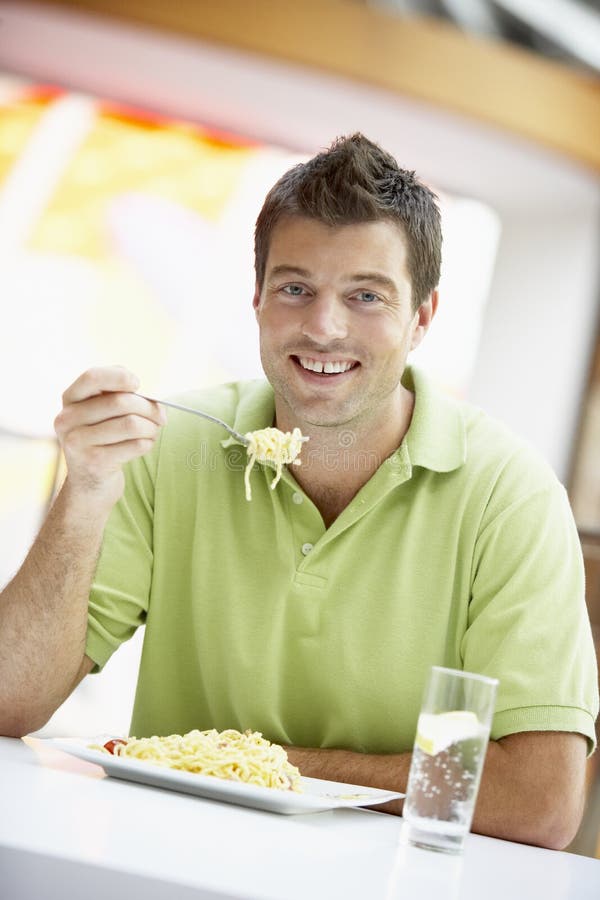 Man Eating Lunch at a Cafe stock photo. Image of colour - 8688274