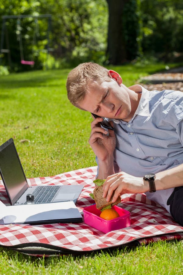 Man eating lunch in garden stock photo. Image of nature - 45968724