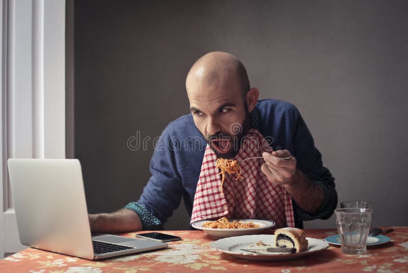 Man Eating Spaghetti Using Computer Stock Photos - Free & Royalty-Free ...
