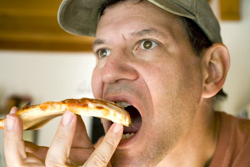 Man Eating Pepperoni Pizza stock photo. Image of hungry - 1323710