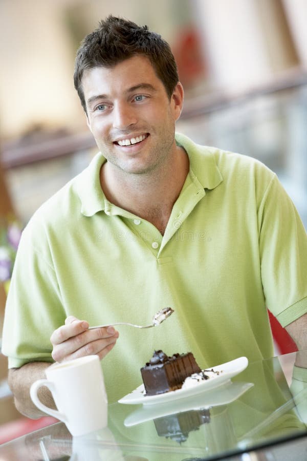 Man Eating a Piece of Cake at the Mall Stock Image - Image of eating ...