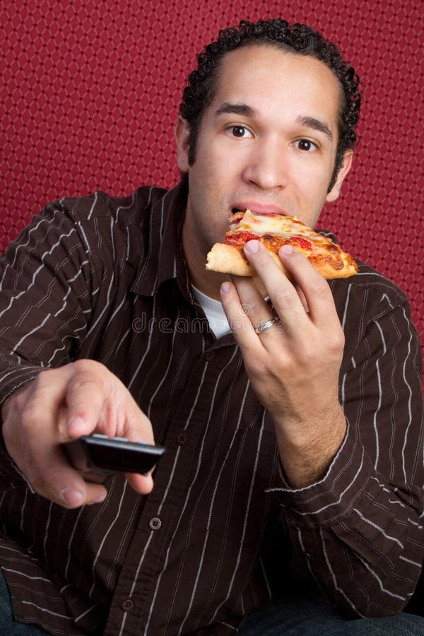 Man Eating Pizza stock photo. Image of african, controller - 13174672