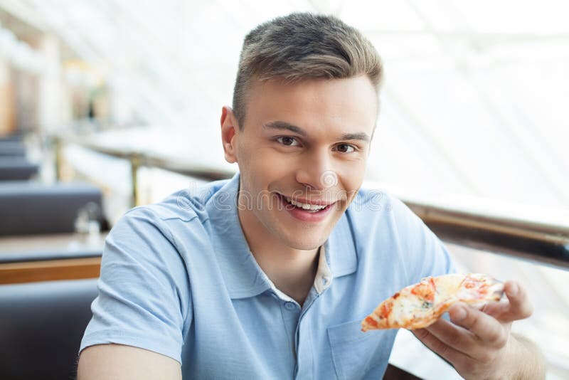 Pizza Man. Cheerful Young Deliveryman Holding a Pizza Box while Stock ...