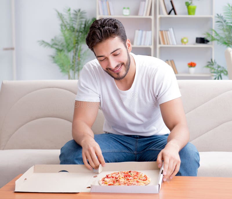 Man Eating Pizza Having a Takeaway at Home Relaxing Resting Stock Photo ...