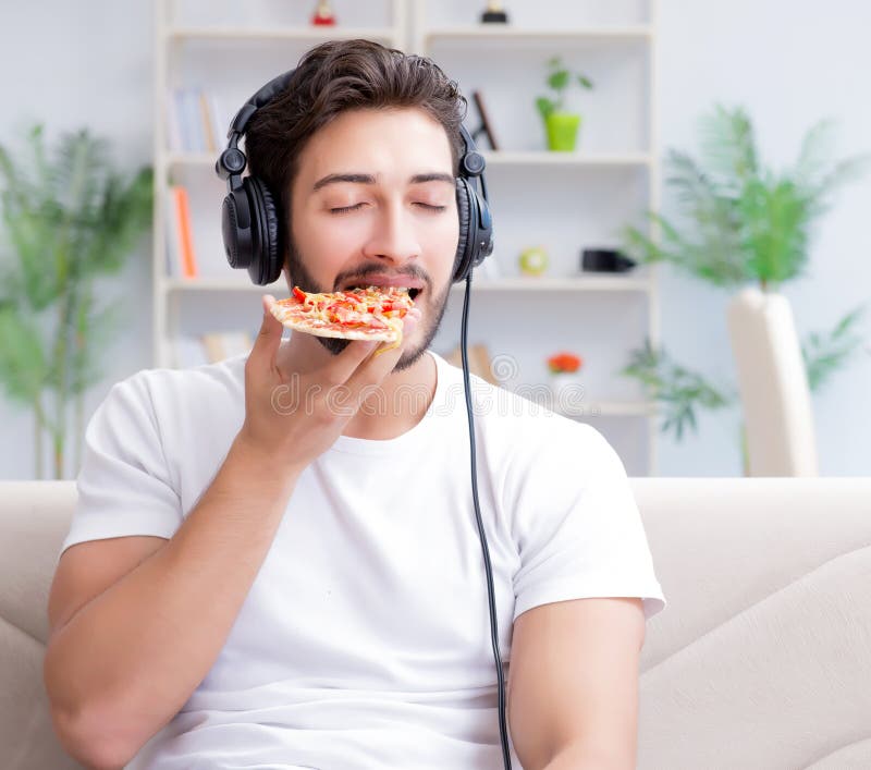 Man Eating Pizza Having a Takeaway at Home Relaxing Resting Stock Photo ...
