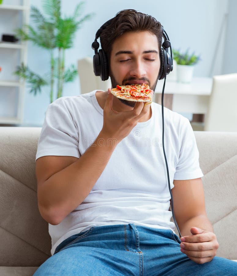 Man Eating Pizza Having a Takeaway at Home Relaxing Resting Stock Photo ...