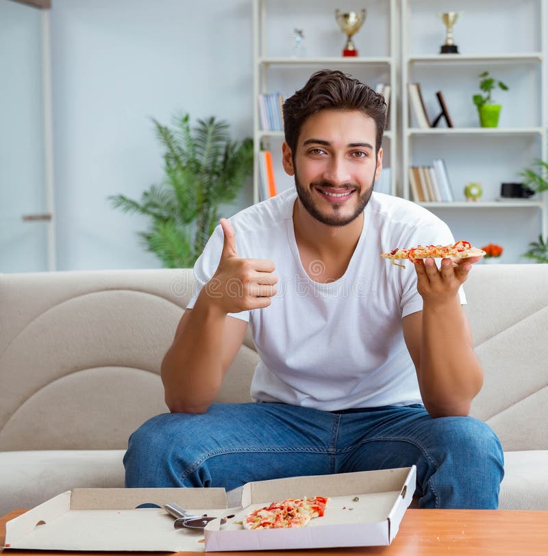 Man Eating Pizza Having a Takeaway at Home Relaxing Resting Stock Image ...
