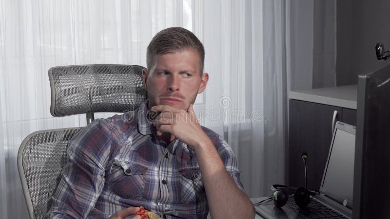 Man Eating Pizza while Working on a Project on His Computer Stock Image ...