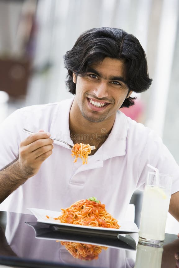 Man Eating Plate of Pasta at Cafe Stock Photo - Image of delicious ...