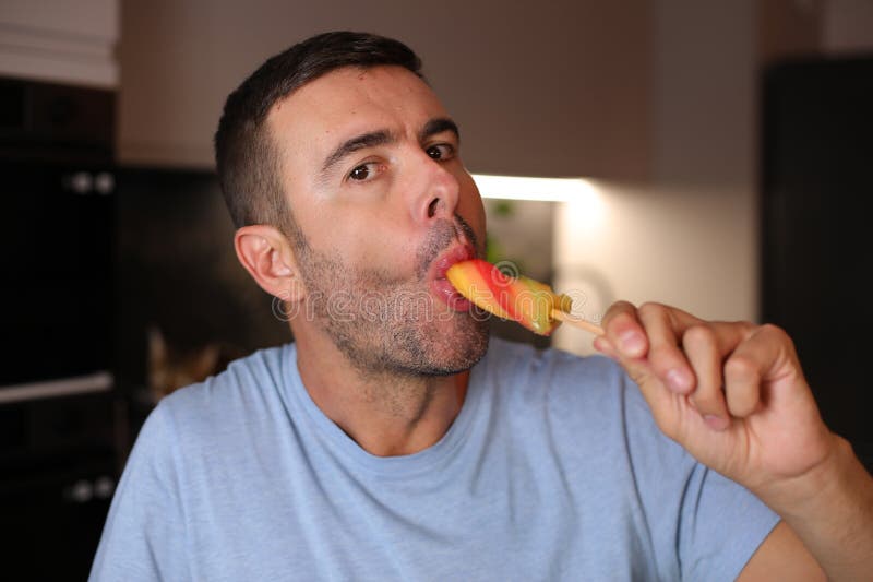 Man Eating a Popsicle with Anxiety Stock Photo - Image of cream, tasty: 329622716