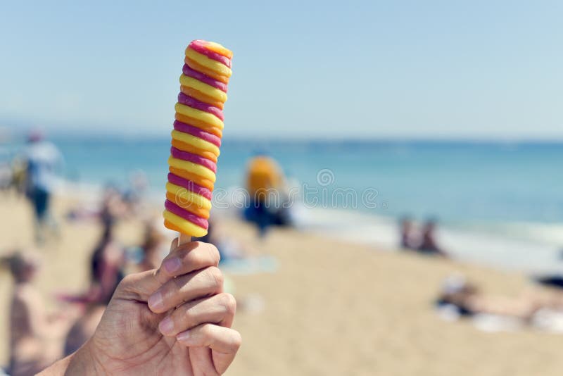 Man Eating a Popsicle on the Beach Stock Image - Image of lolly ...