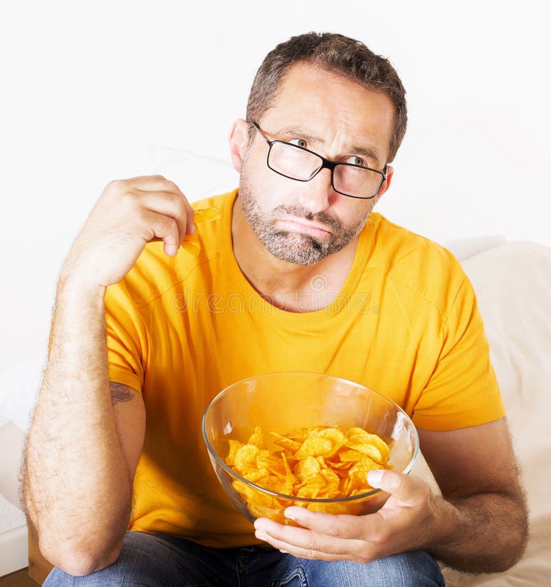 Man eating potato chips stock photo. Image of greedy - 42281192