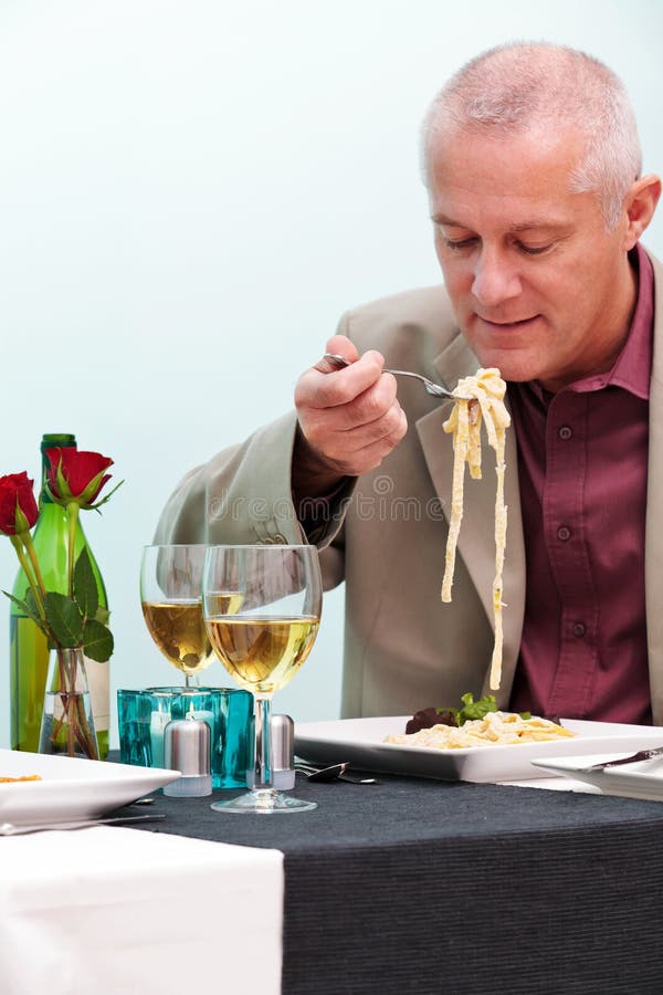 Man eating in a restaurant stock image. Image of meal - 23044105
