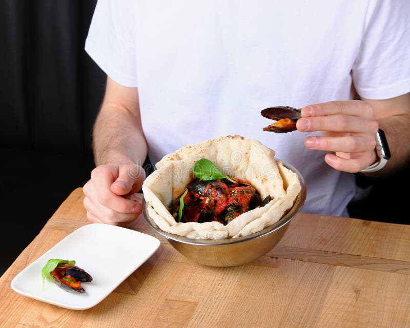 Man Eating in Restaurant and Dishes on Table Stock Image - Image of ...