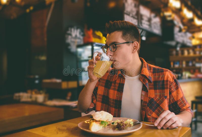 Man is Eating in a Restaurant and Enjoying Delicious Food Stock Image ...