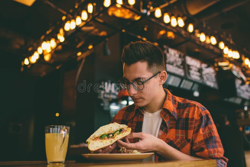 Man Eating in a Restaurant and Enjoying Delicious Food Stock Image ...
