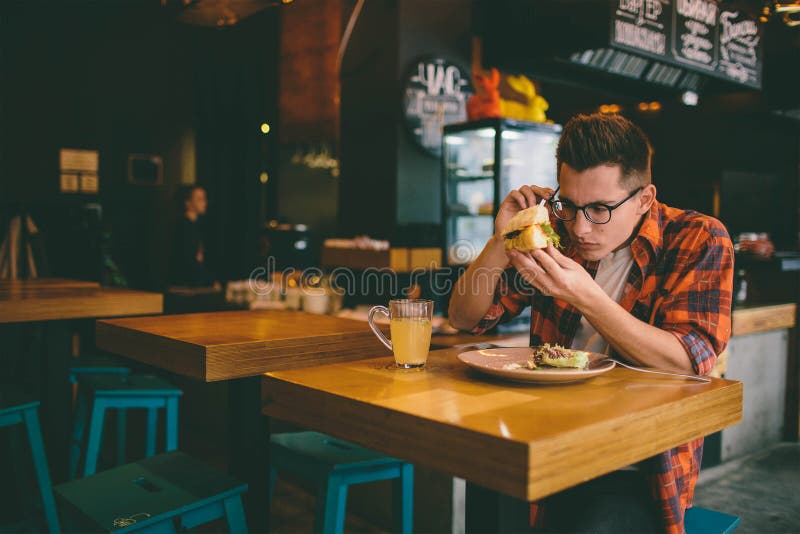 Man Eating in a Restaurant and Enjoying Delicious Food Stock Photo ...