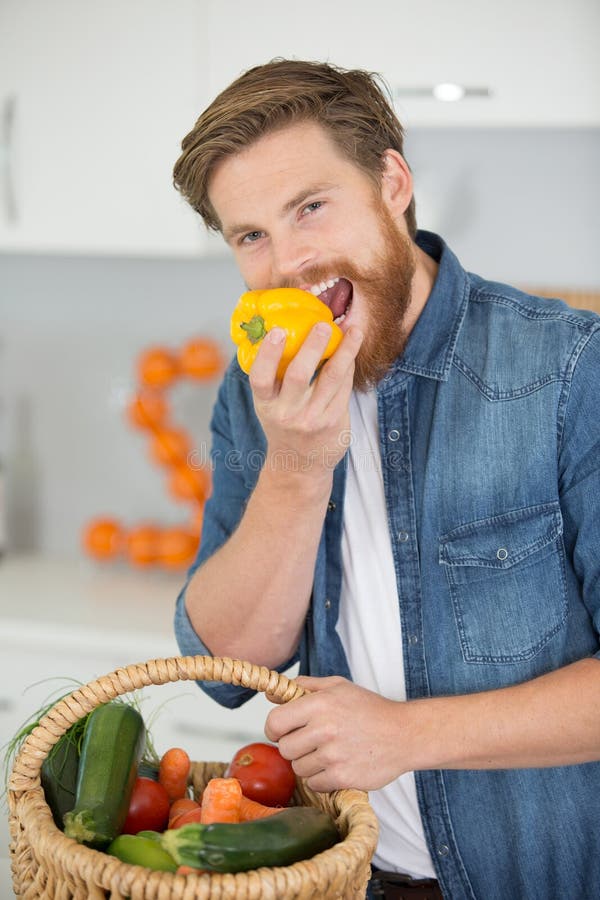 Man eating row pepper stock photo. Image of intact, gourmet - 263374810