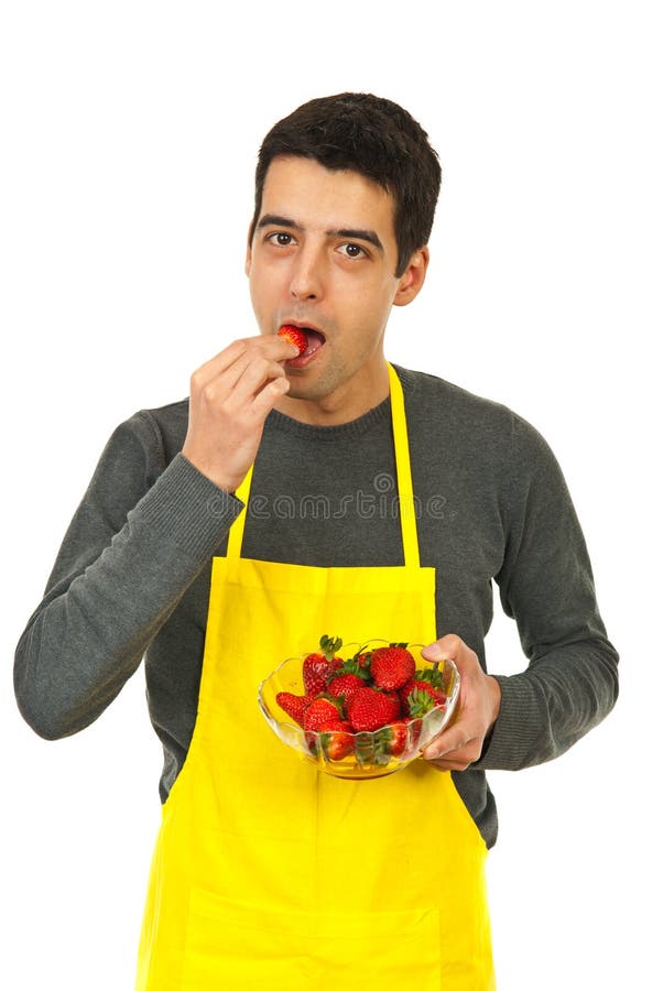 Chef Man Eating Strawberry in Kitchen Stock Image - Image of hold ...